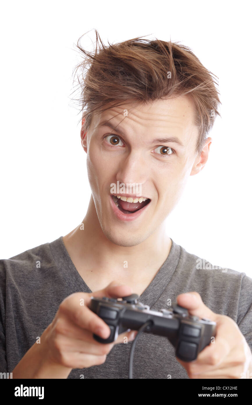 Laughing man plays computer game using joystick Stock Photo - Alamy