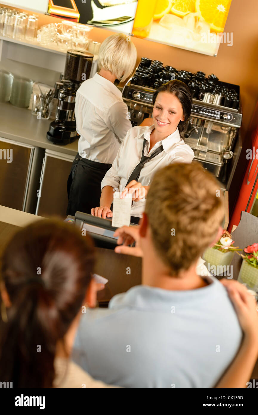 Cafe employee woman giving man bill receipt woman customer bar Stock ...