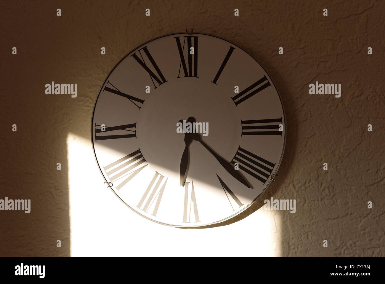 Sunlight and shadow on a traditional clock face Stock Photo - Alamy