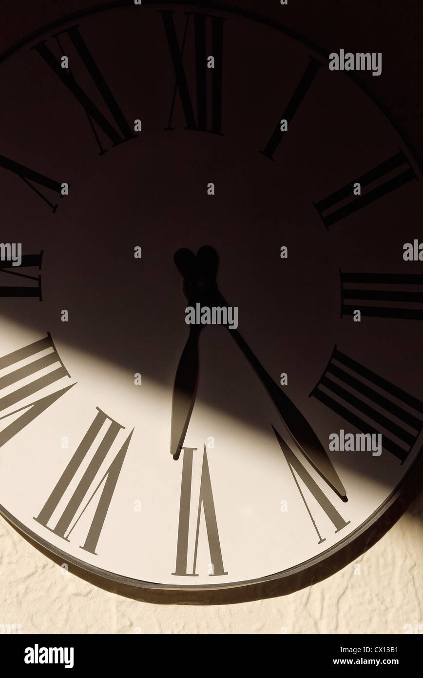 Sunlight and shadow on a traditional clock face Stock Photo - Alamy