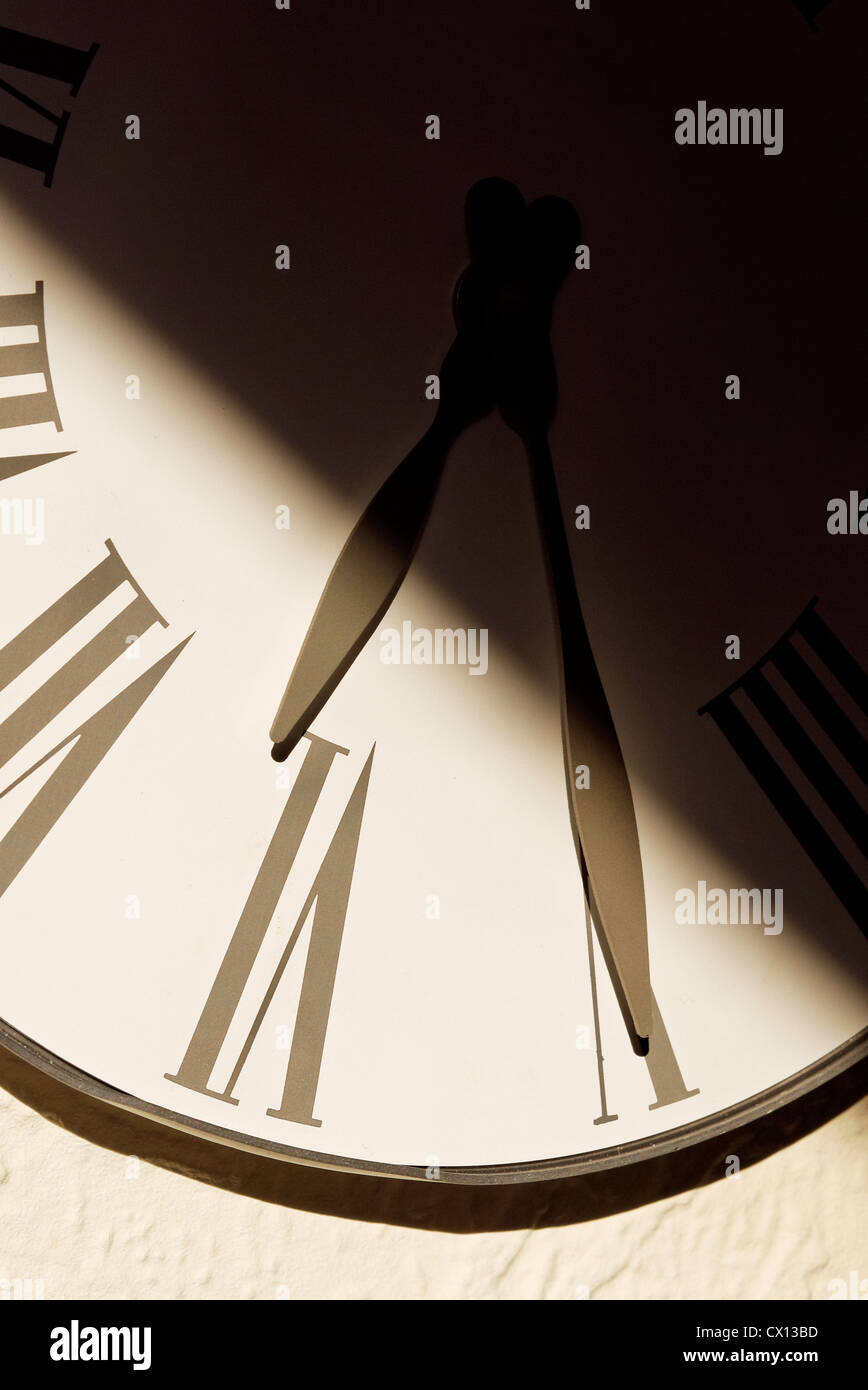 Sunlight and shadow on a traditional clock face Stock Photo - Alamy
