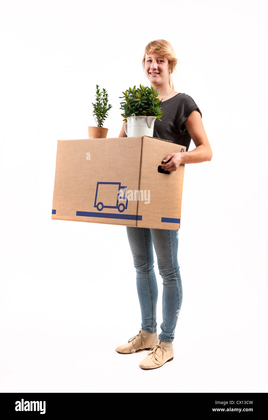 Moving, symbol image. Woman is carrying moving boxes Stock Photo - Alamy