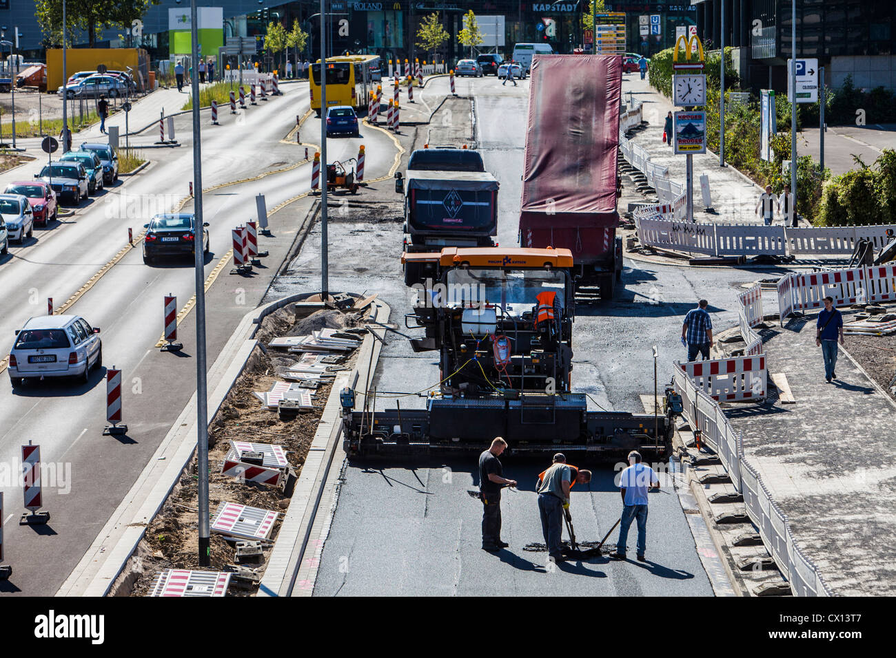 Rebuilding of an inner city road. New asphalt surface Stock Photo - Alamy