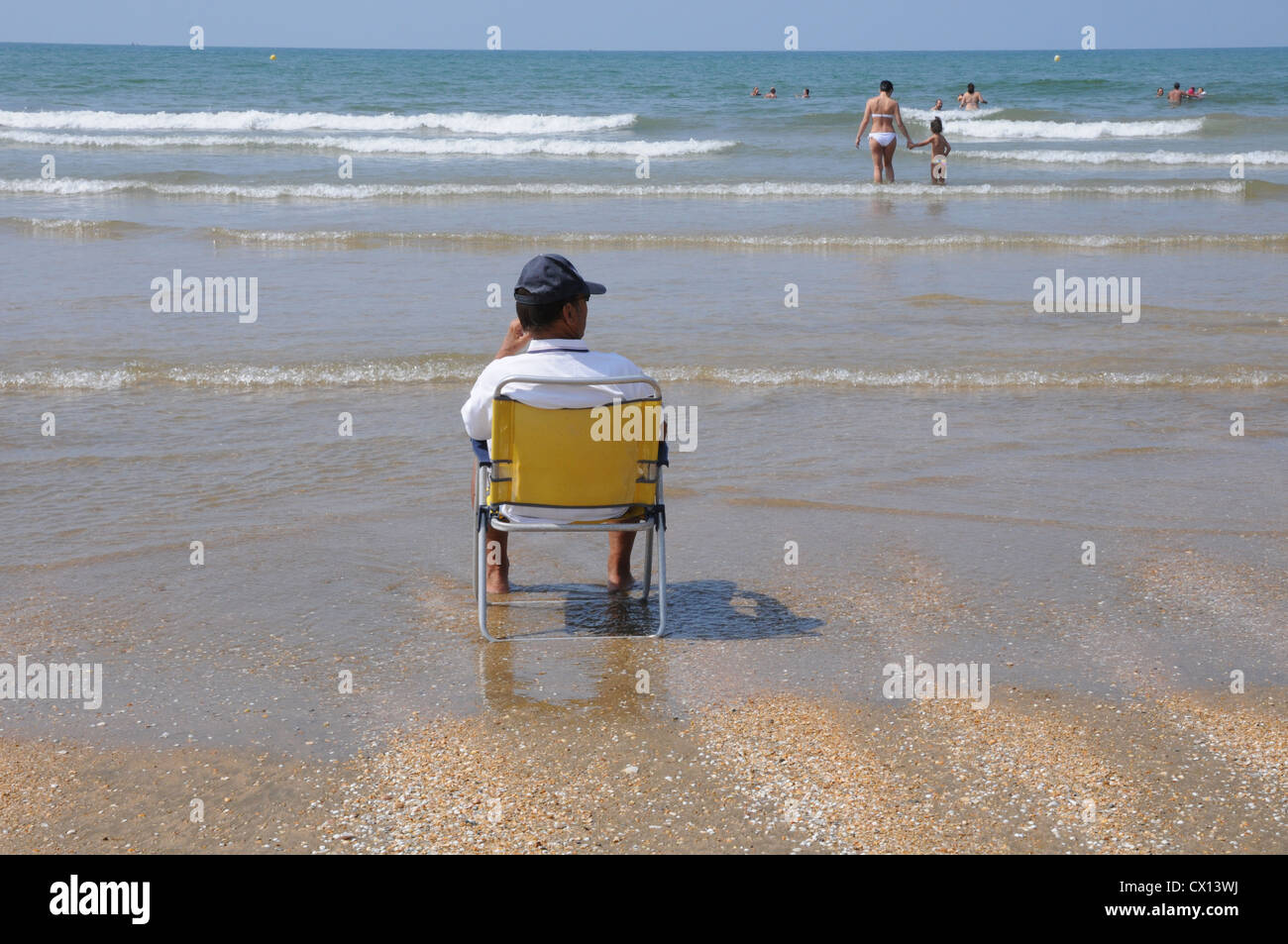 Beach chair in shallow sea enjoying view hi-res stock photography and ...