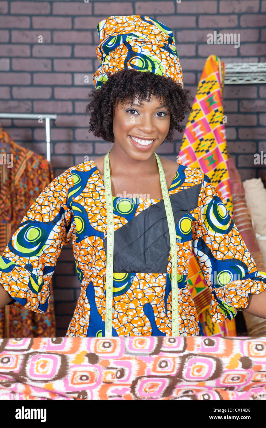 Portrait of an African American female fashion designer working on ...