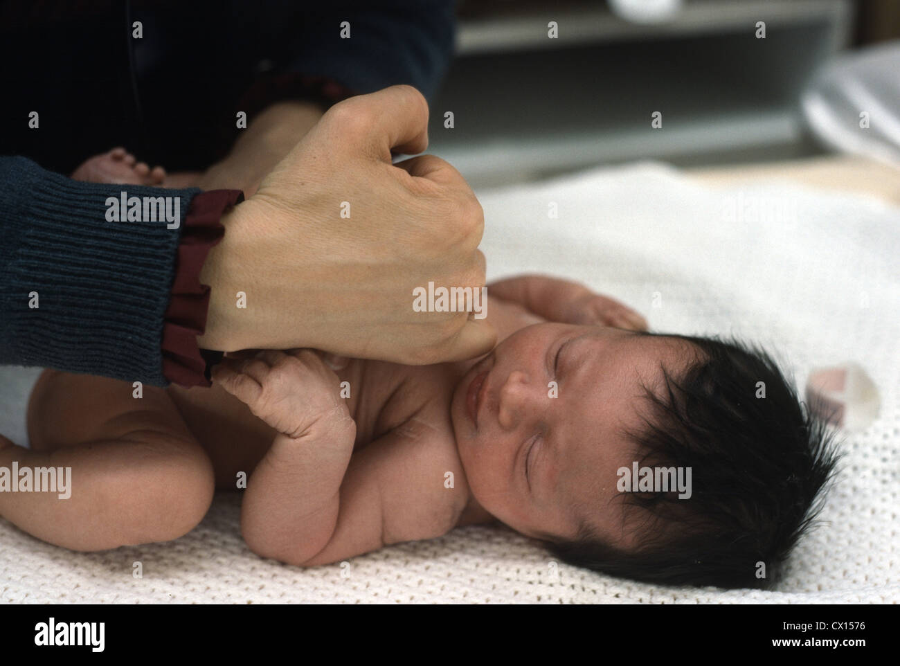 Newborn reflexes hi-res stock photography and images - Alamy