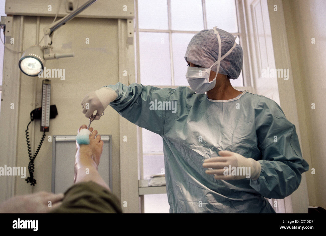 Operating room in hospital where surgeion is performing an operation on ...