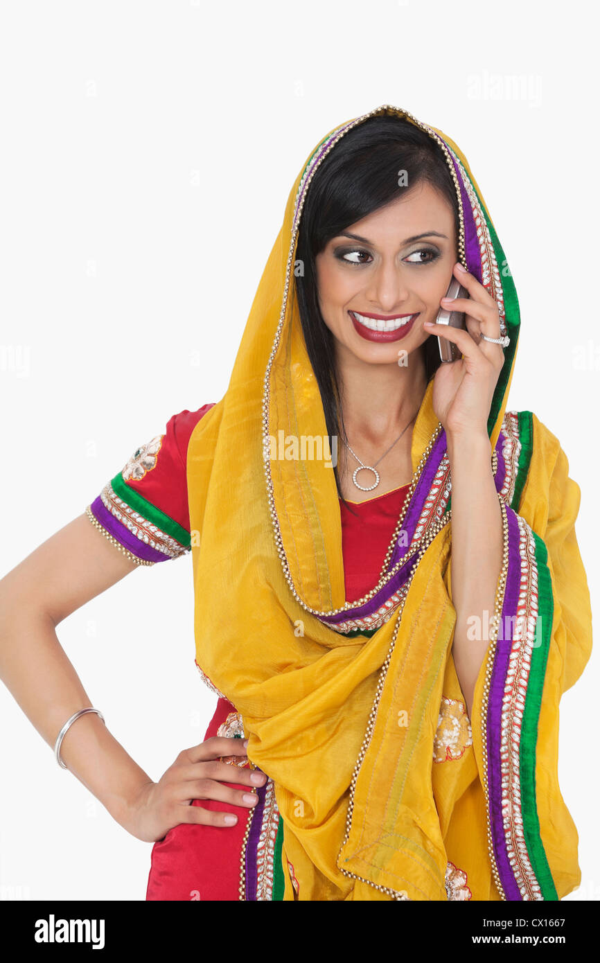Beautiful indian woman answering phone hi-res stock photography and ...