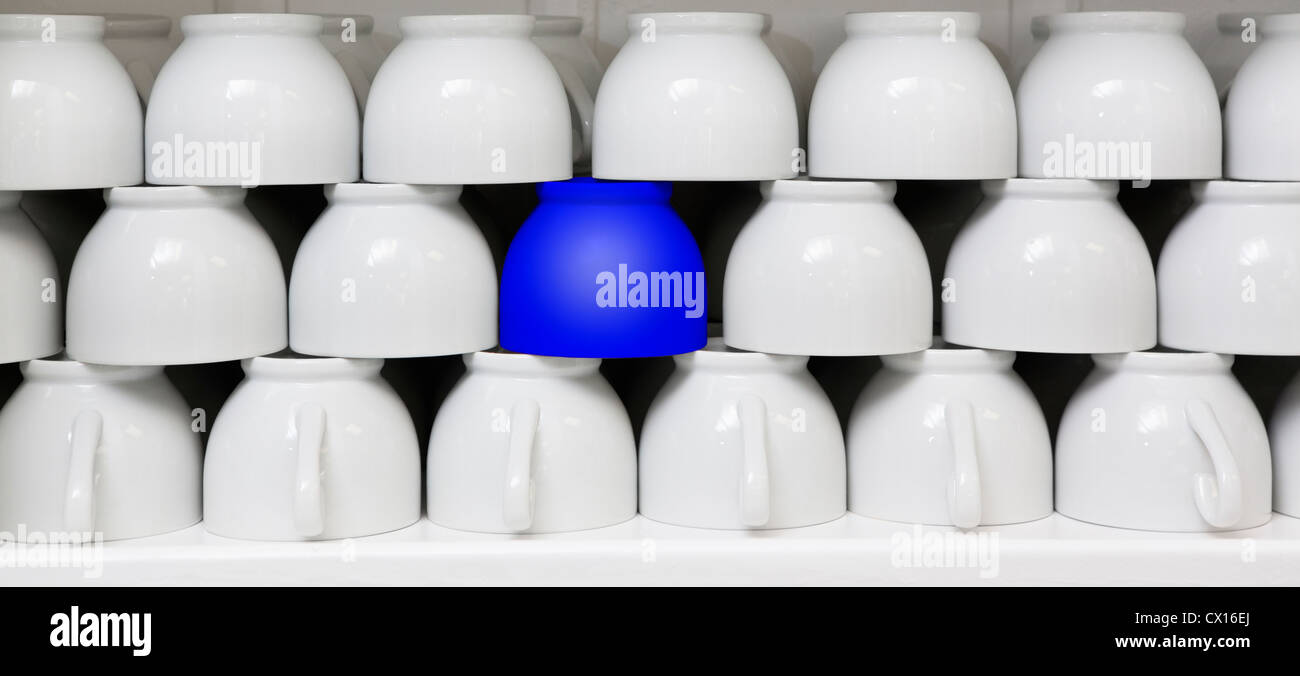 Blue cup amid white coffee cups Stock Photo - Alamy