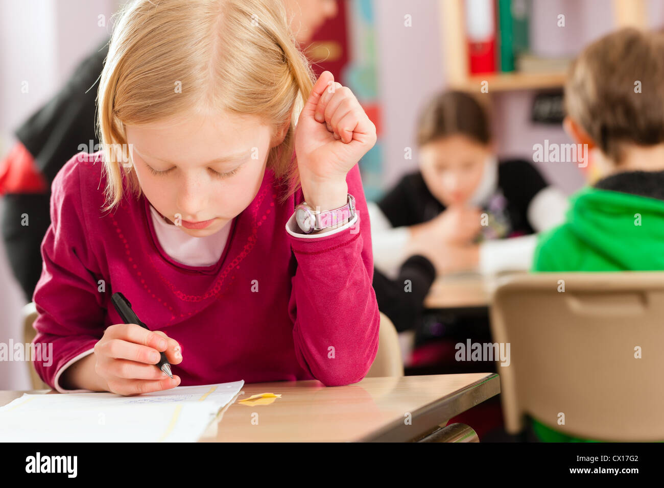 Education - Pupils and teacher learning at elementary or primary school ...