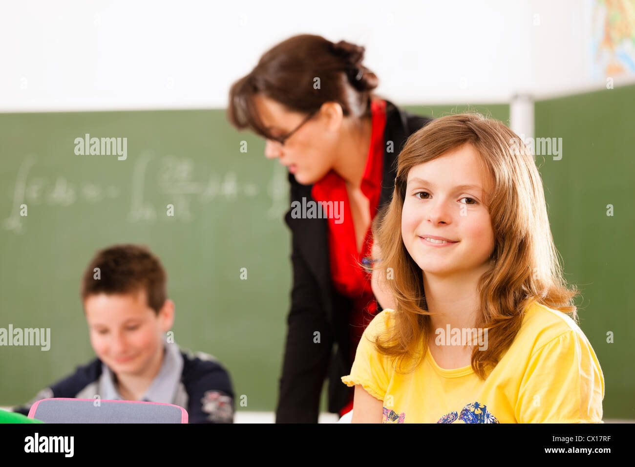 Education - Pupils and teacher learning at elementary or primary school ...