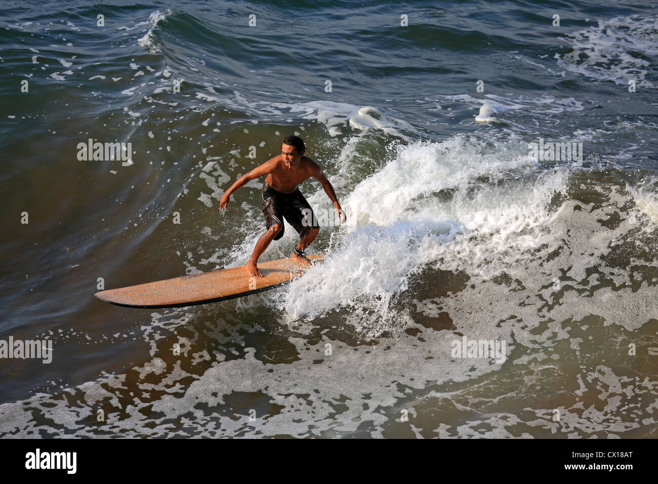 Skilled surfer riding a wave hi-res stock photography and images - Alamy