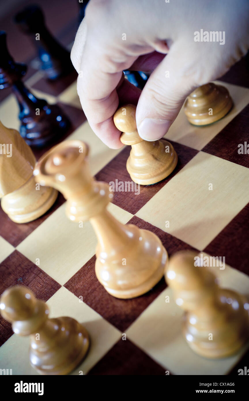 playing a chess pawn move Stock Photo - Alamy