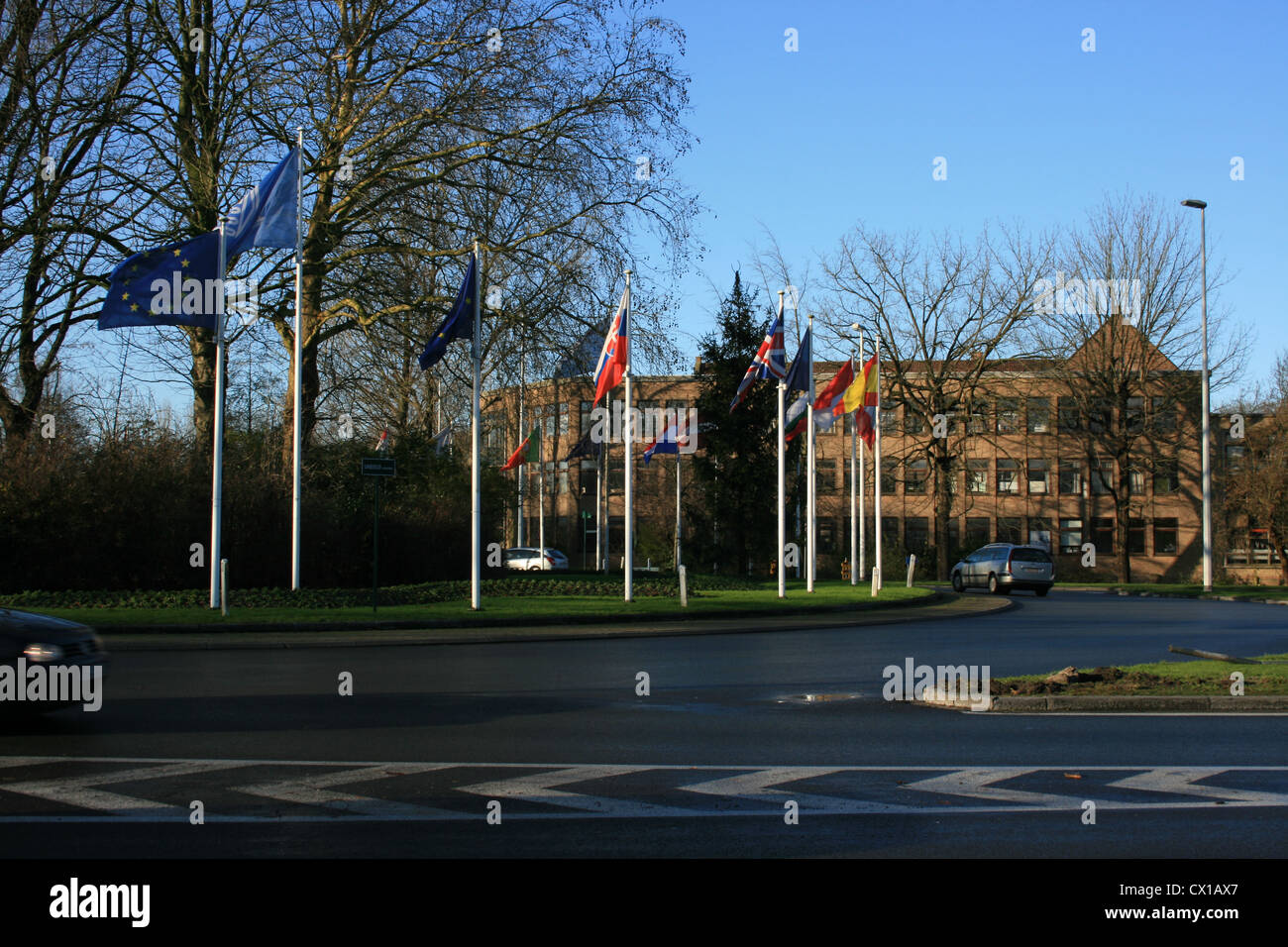 Empty Road, Flags Flying, Blue Sky Trees Stock Photo - Alamy