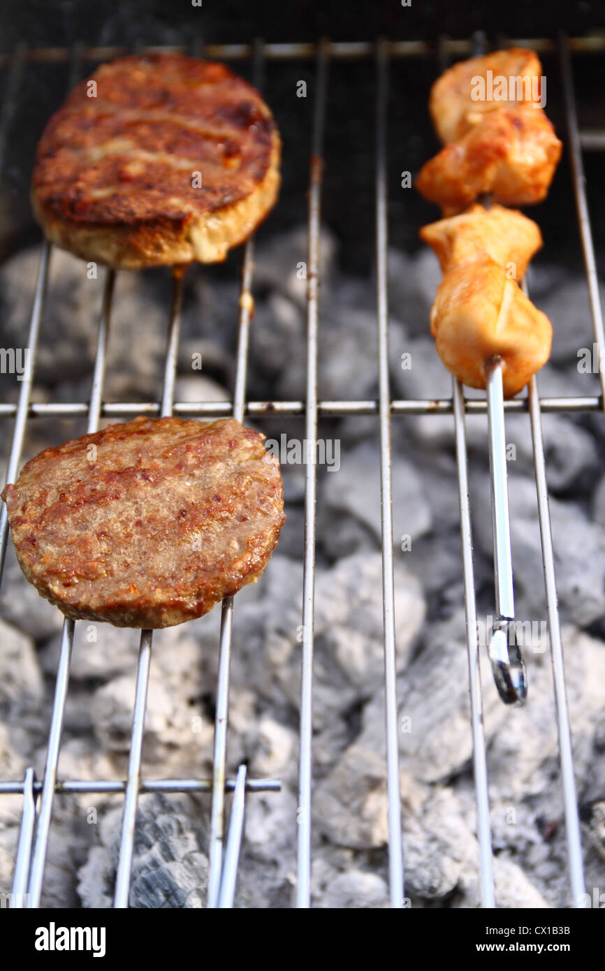 Burgers and Kebab on Barbecue Stock Photo - Alamy