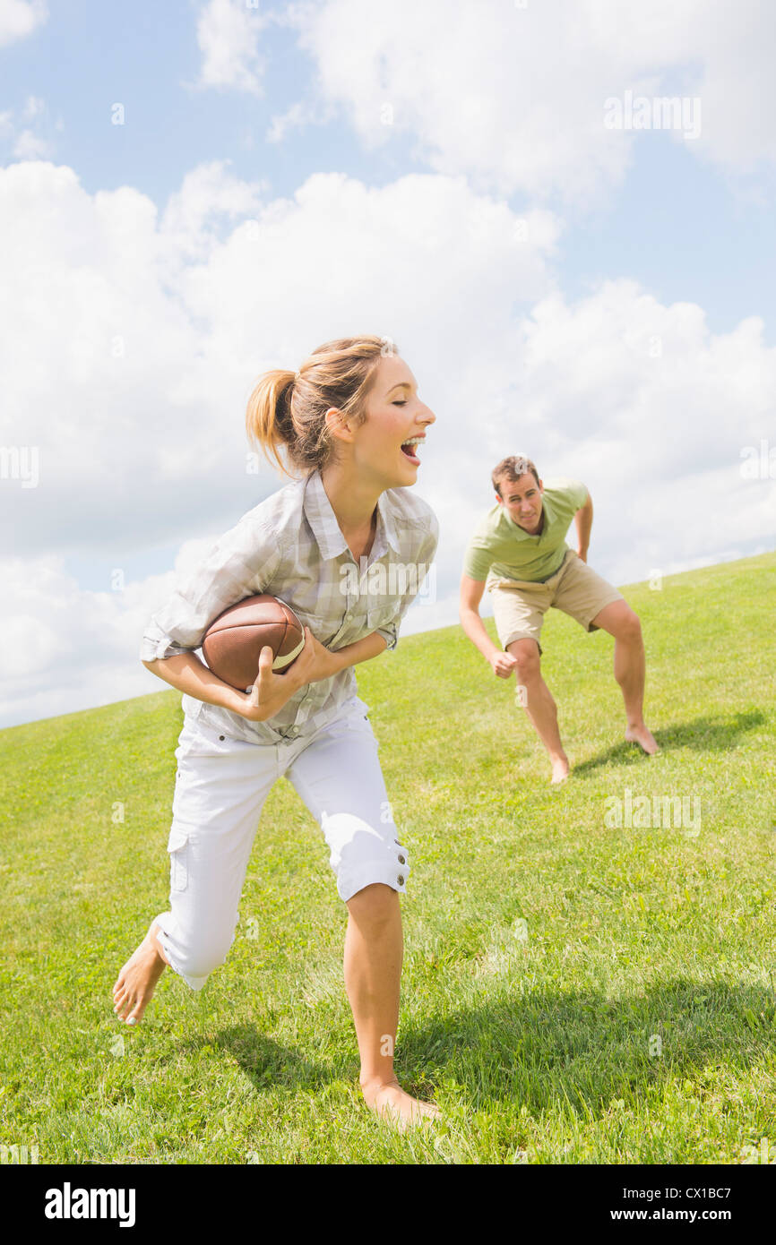 USA, New Jersey, Mendham, Couple playing with football Stock Photo - Alamy