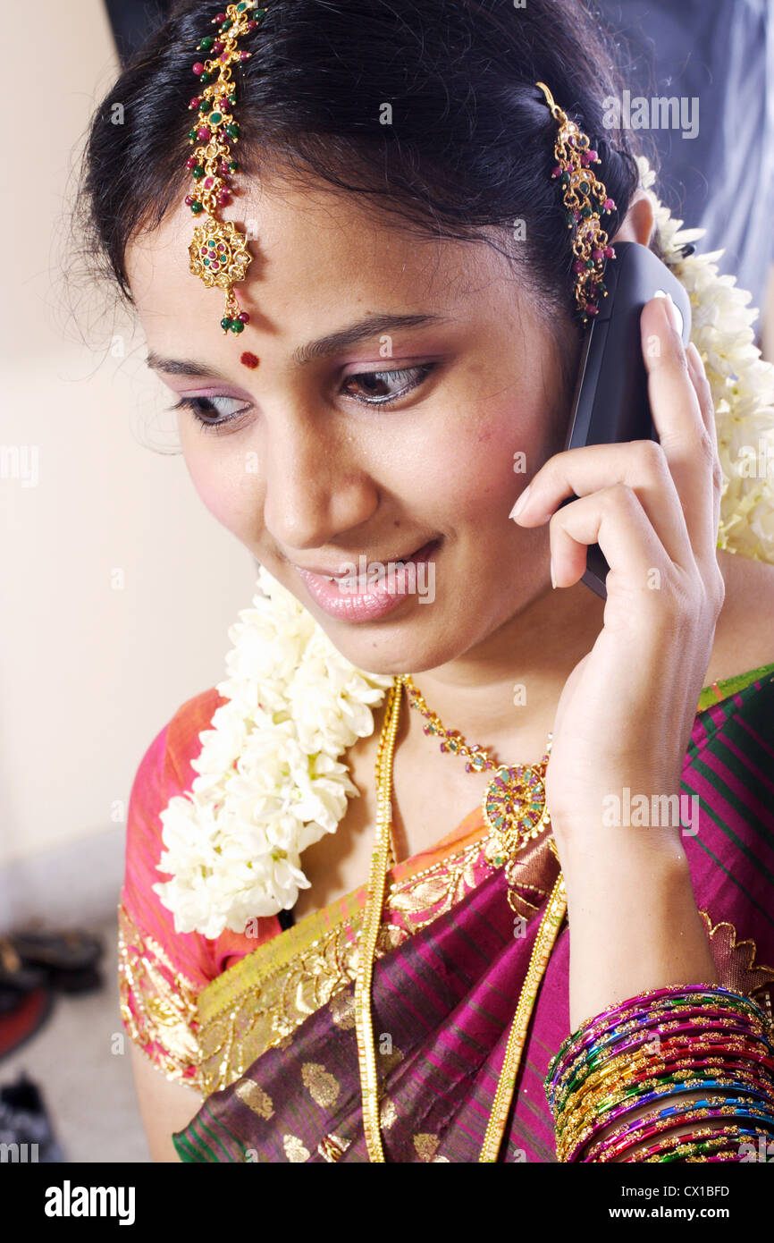 Traditional young Indian woman talking on a cellphone Stock Photo - Alamy