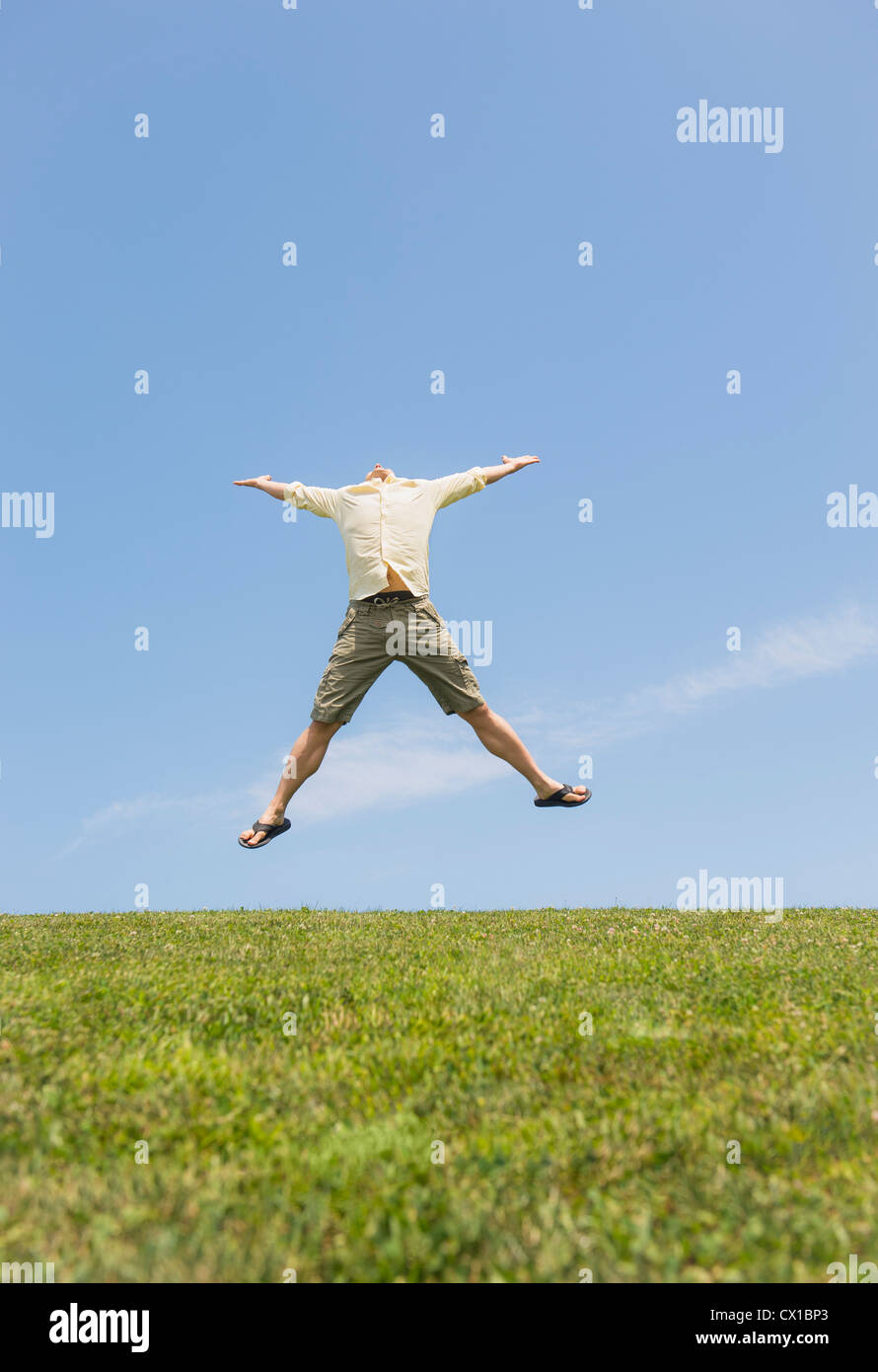 USA, New Jersey, Mendham, Man jumping on meadow Stock Photo - Alamy