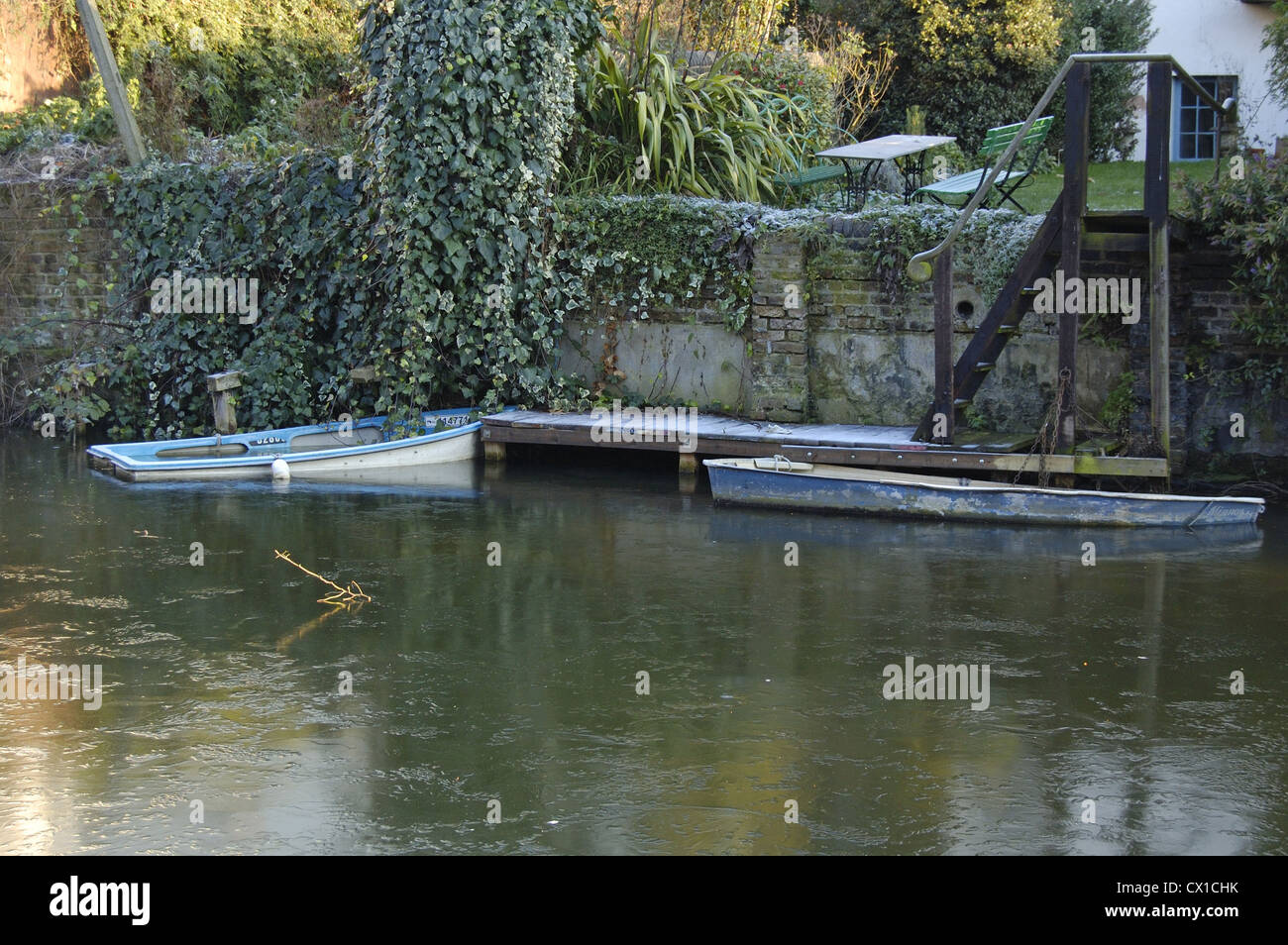 Frozen canal surface and boats at small mooring Stock Photo - Alamy