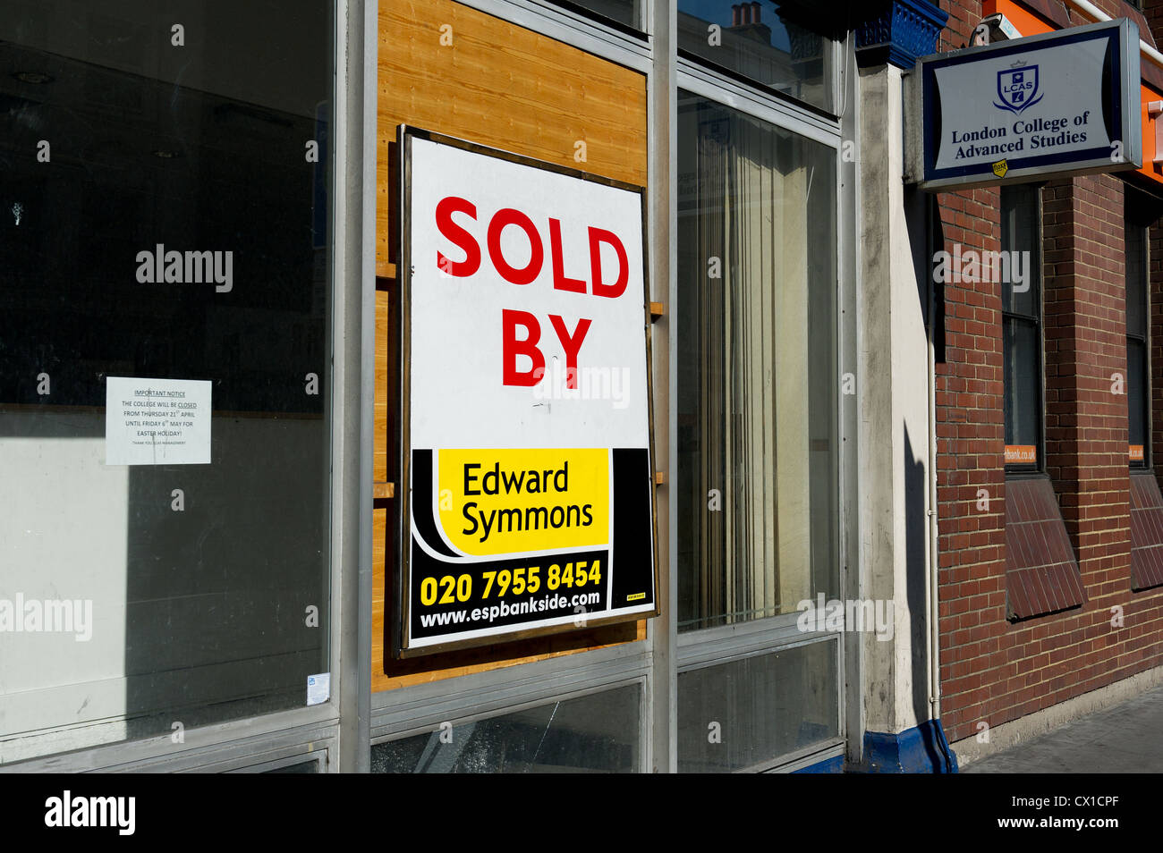 Signs in a window of a building in London Stock Photo - Alamy