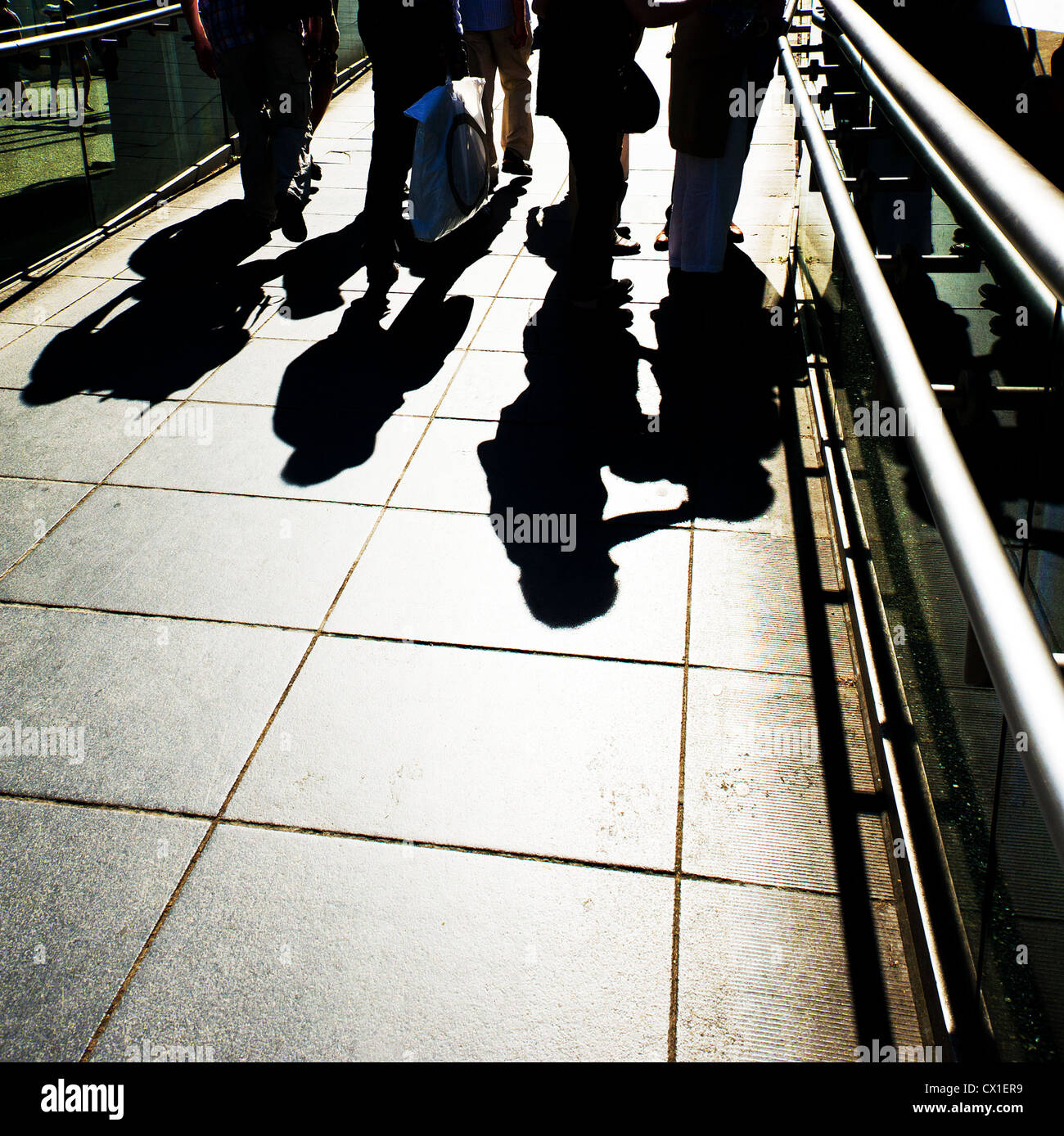 Shadows cast by people in bright sunshine Stock Photo - Alamy
