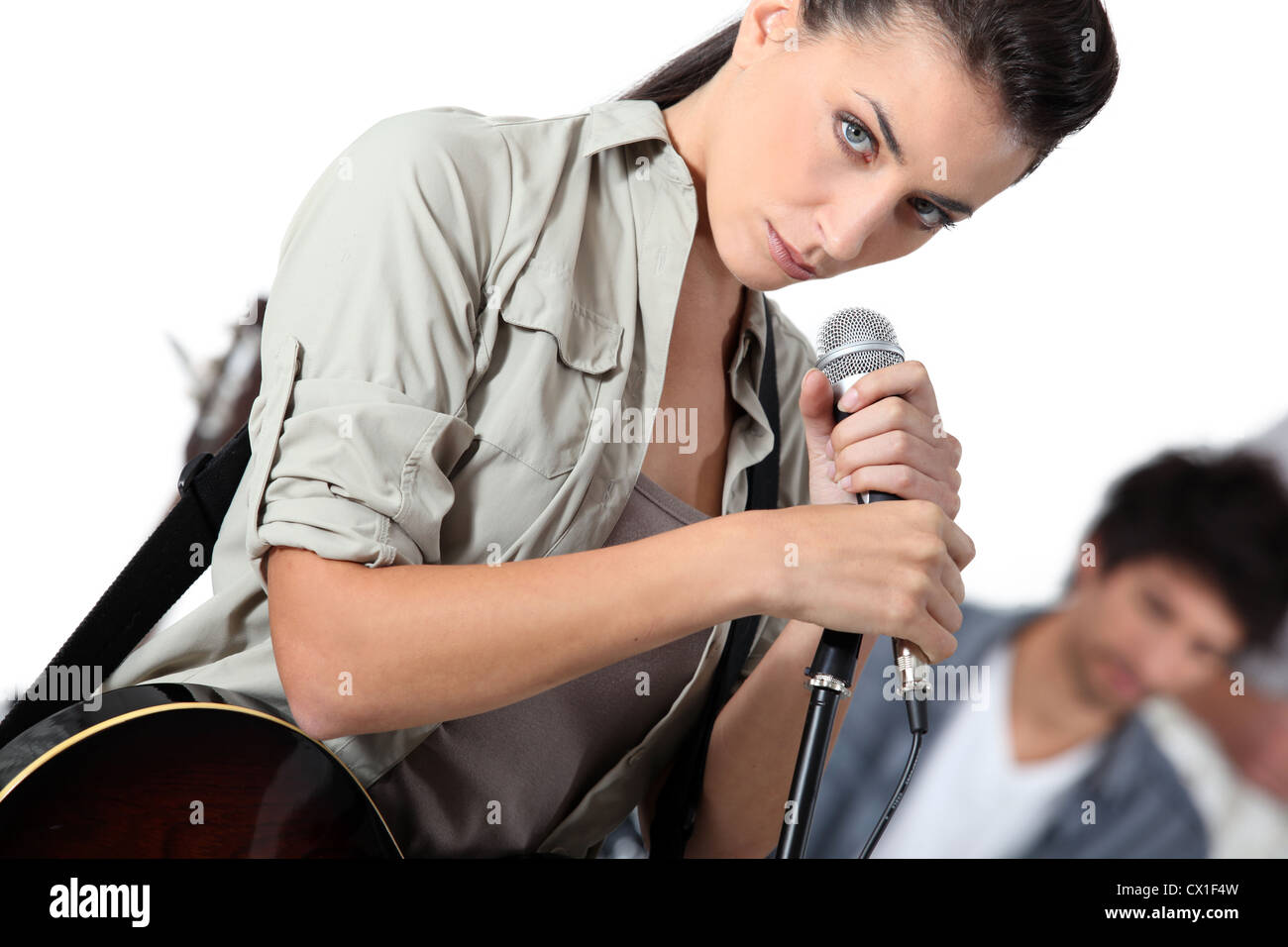 Female singer in a rock band Stock Photo - Alamy