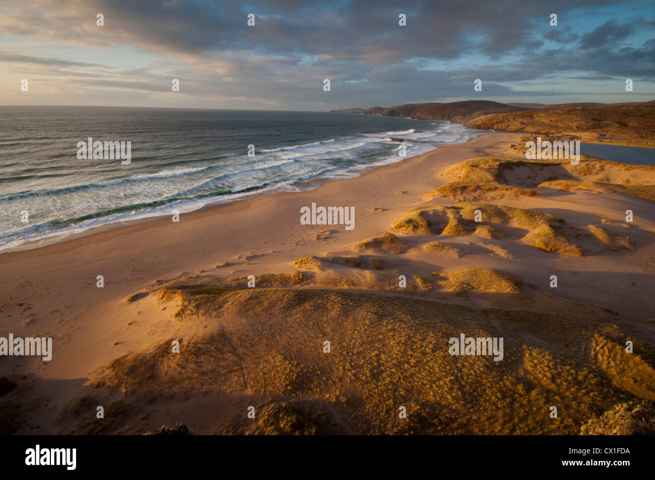 Sandwood Bay at sunset, bathed in golden light, north west coast of ...