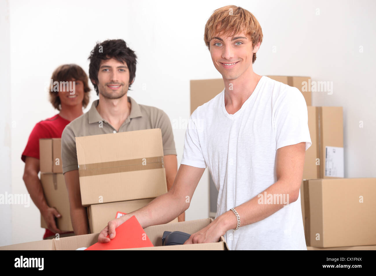 Men moving home Stock Photo - Alamy