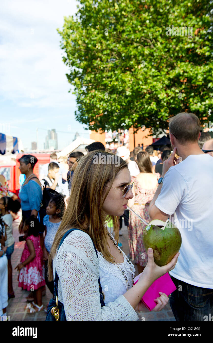 Girl drinking from a coconut hi-res stock photography and images - Alamy
