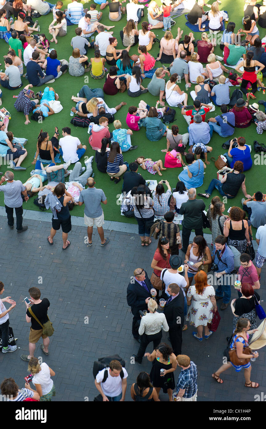 People standing and sitting Stock Photo - Alamy