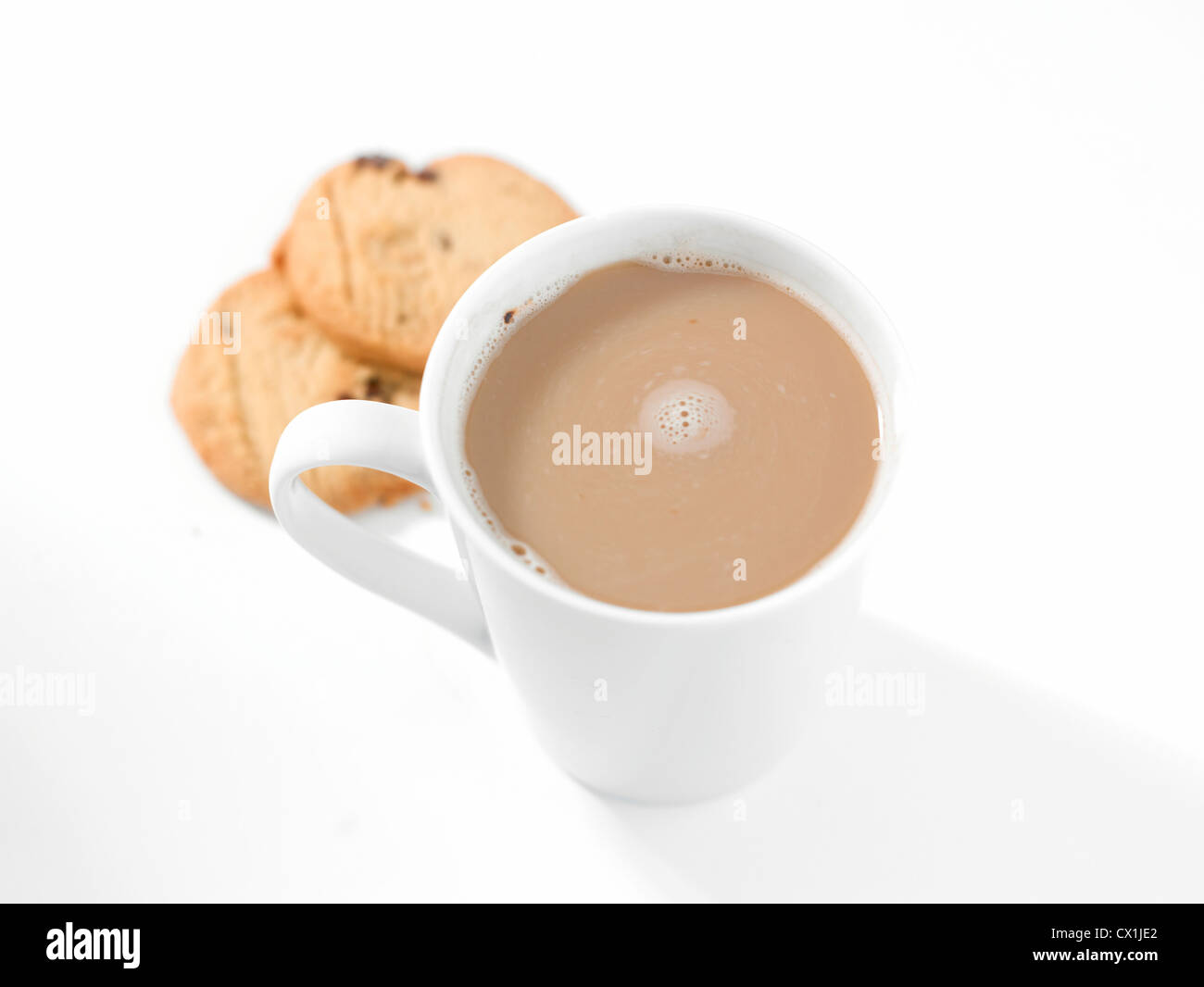 Seen from above a stylized and high key view of a mug of white coffee ...