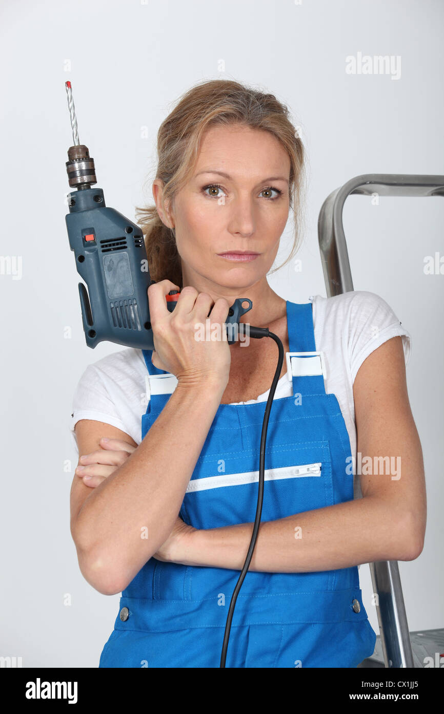 Woman with drill Stock Photo - Alamy