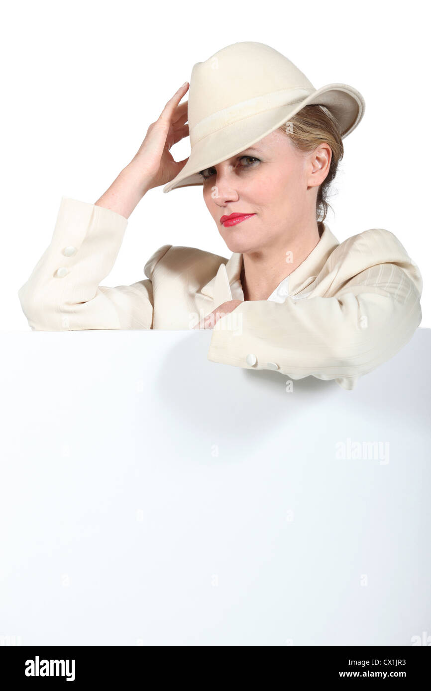 Woman holding hat Stock Photo - Alamy