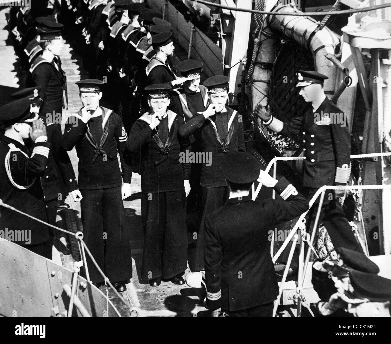 King George V1 is piped aboard a Royal Navy warship during WW11 Stock ...
