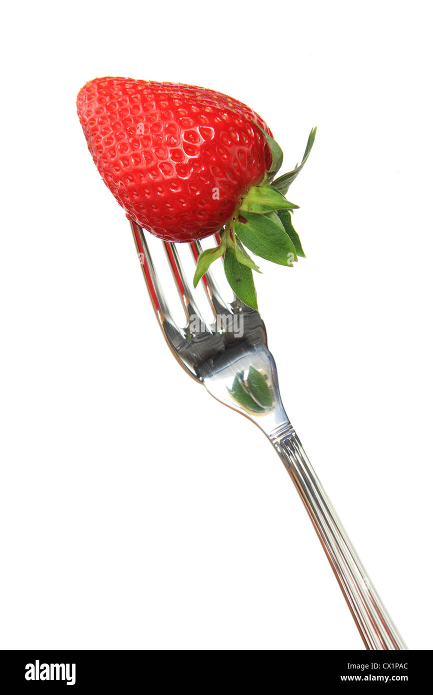 Close-up of a strawberry and fork isolated on a white background Stock ...