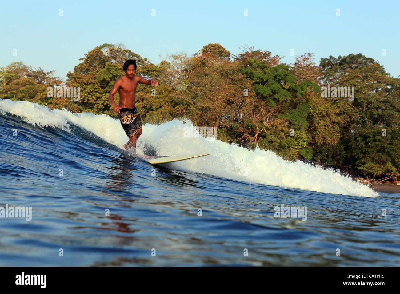 Skilled surfer on large waves hi-res stock photography and images - Alamy