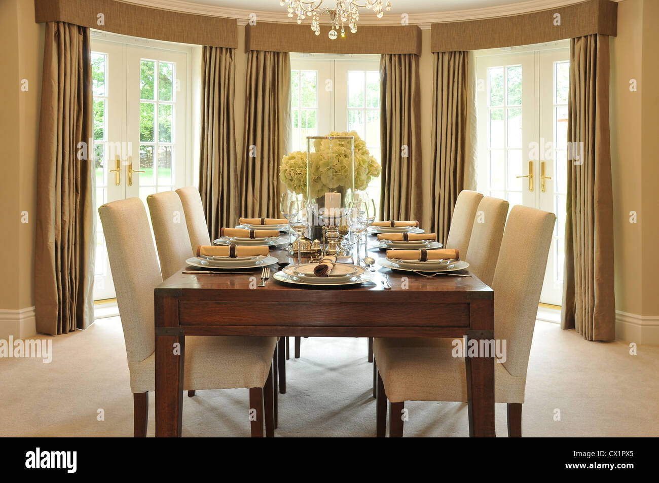 The dining room of an interior designed luxury house with a set table ...