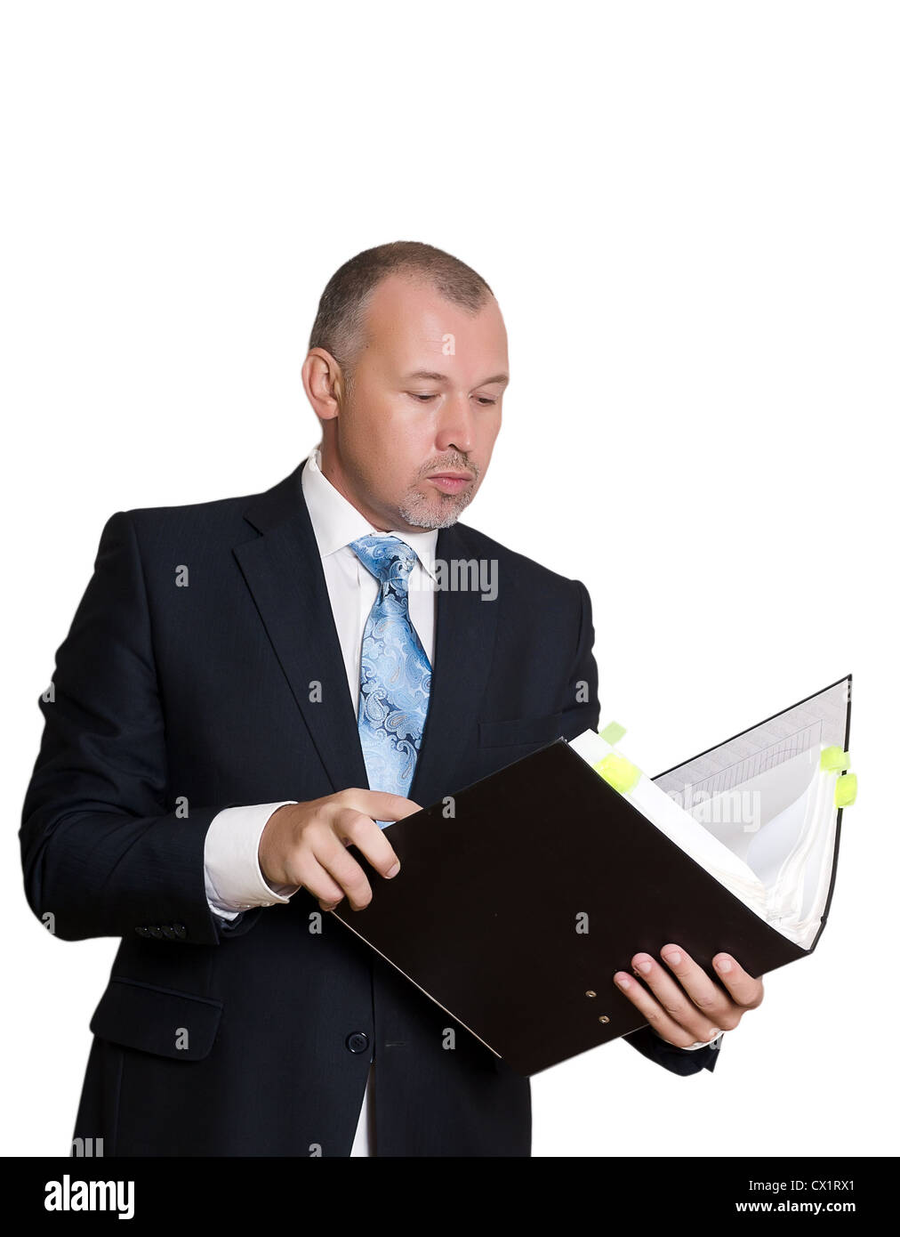 man in a business suit reading documents in a folder Stock Photo - Alamy