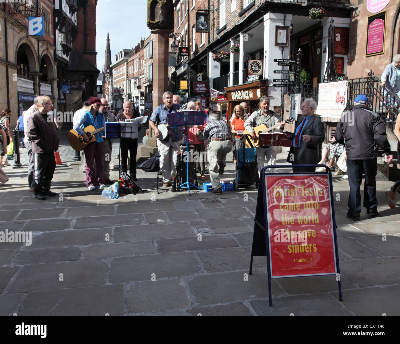 Christian open air outreach group singing and preaching at the Cross ...