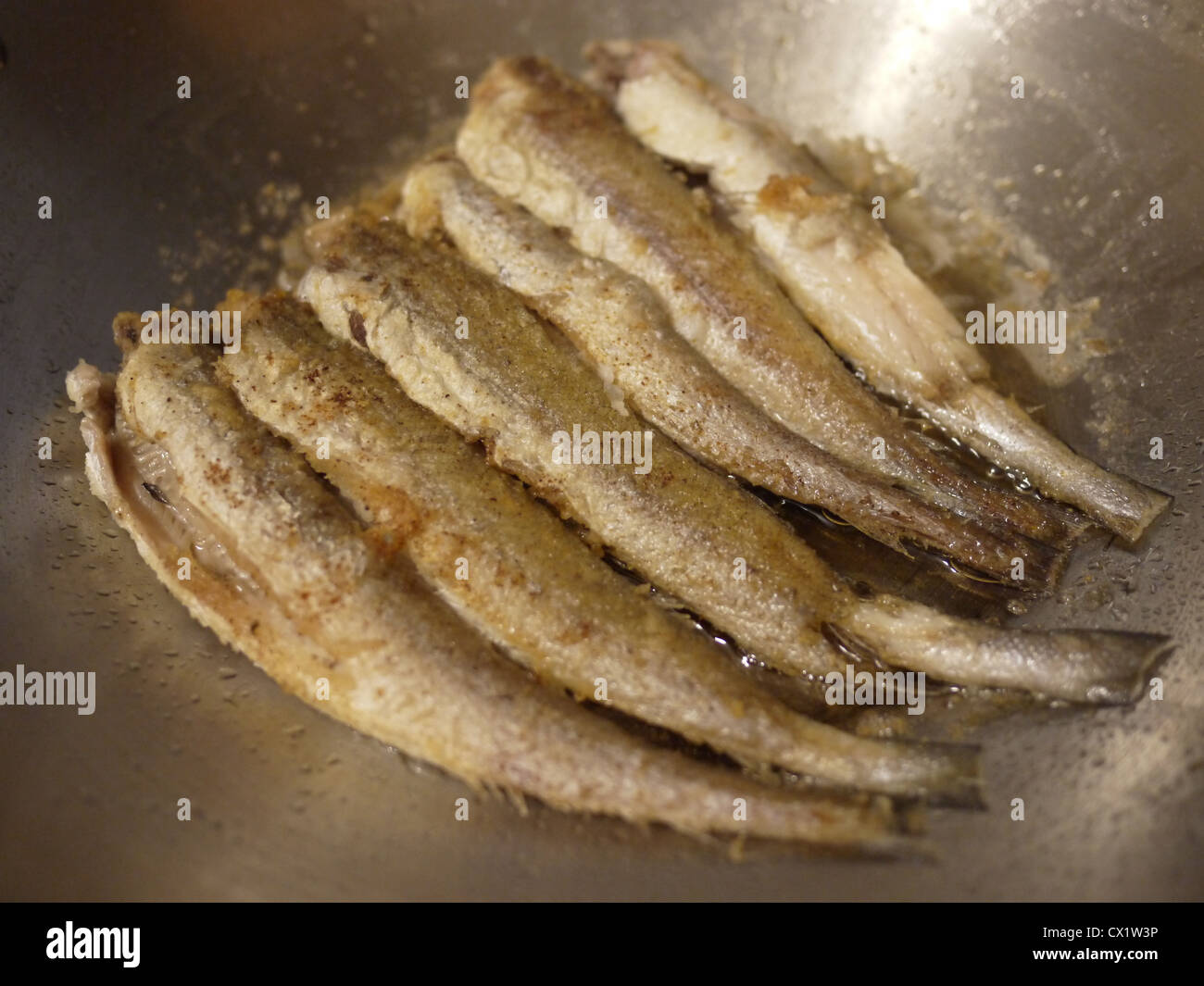 frying fishes chinese wok deep fried Stock Photo - Alamy