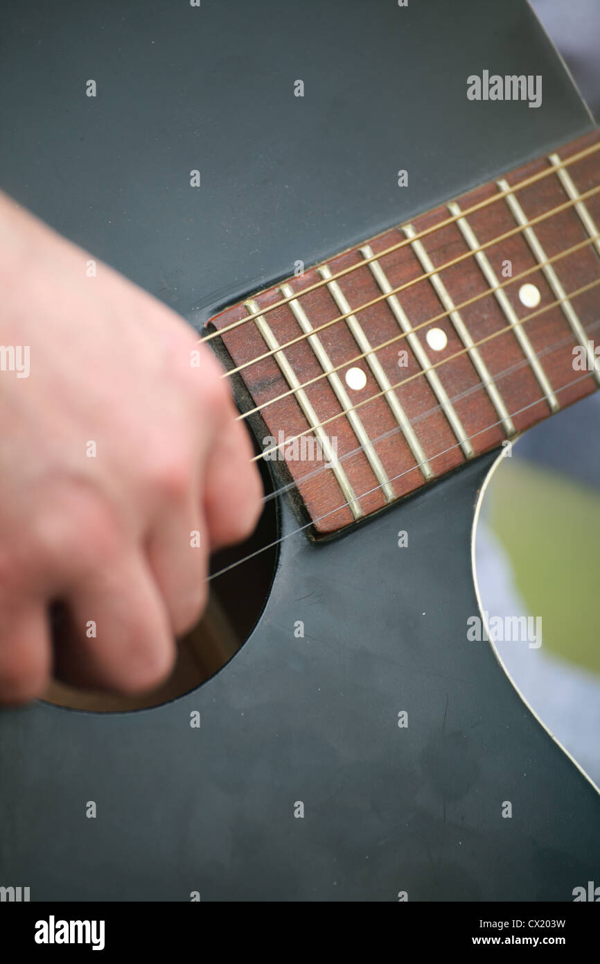 boys hand with a guitar Stock Photo - Alamy