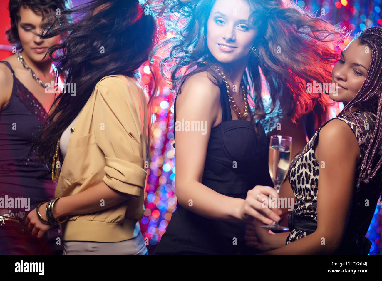 Fashionable women dancing together hi-res stock photography and images ...