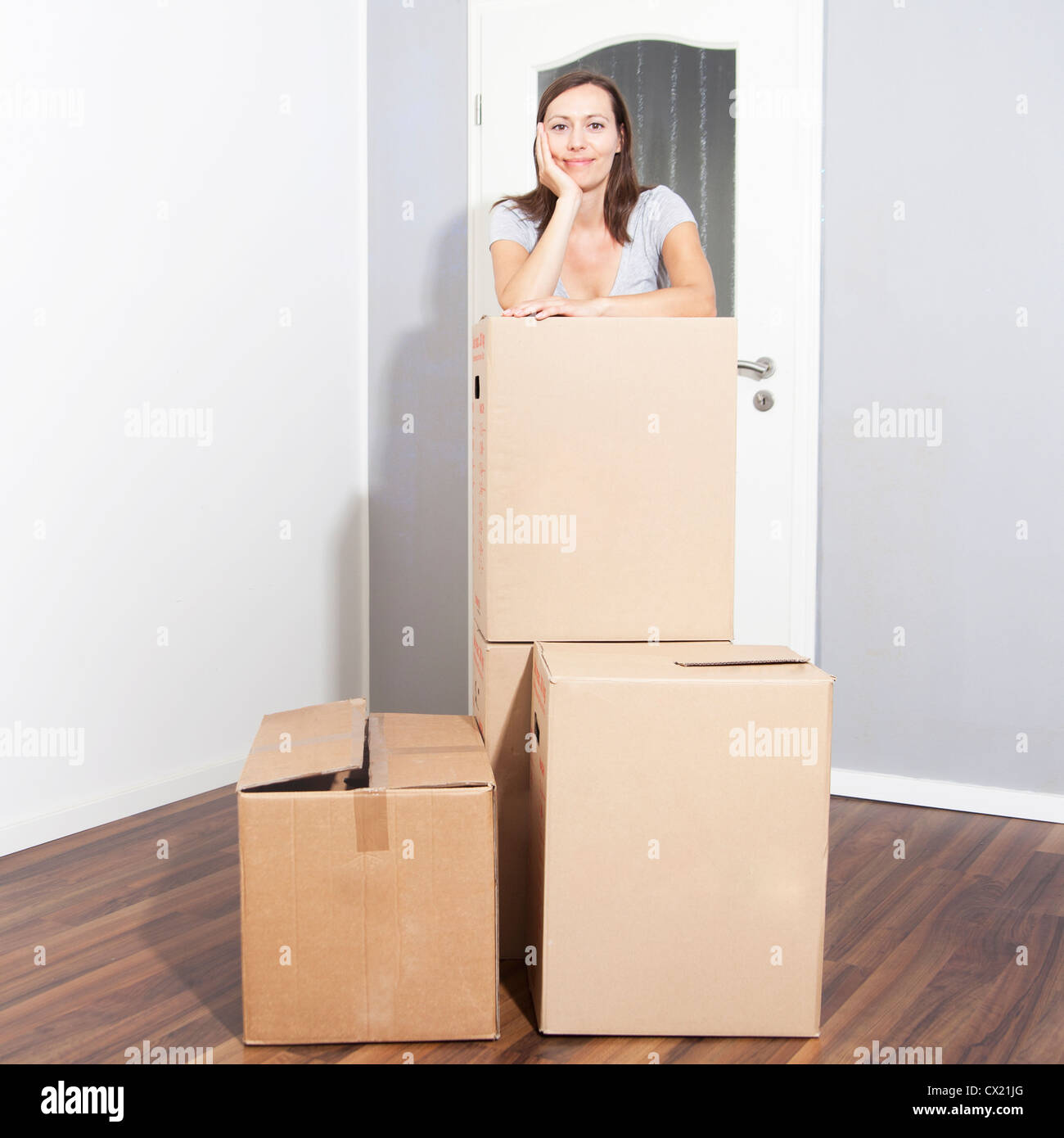 Woman moving house Stock Photo - Alamy
