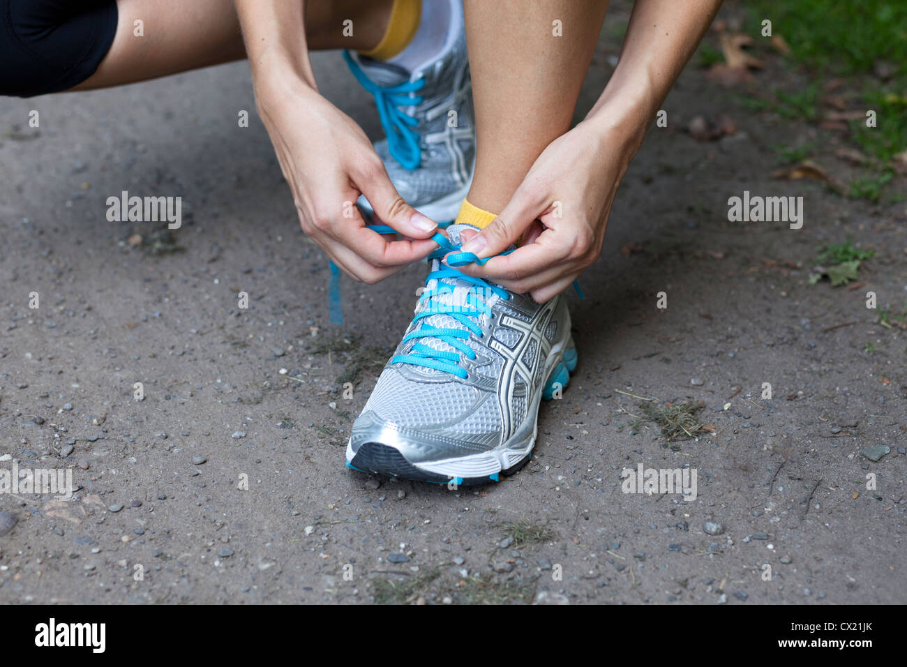 Tying sport shoe Stock Photo - Alamy