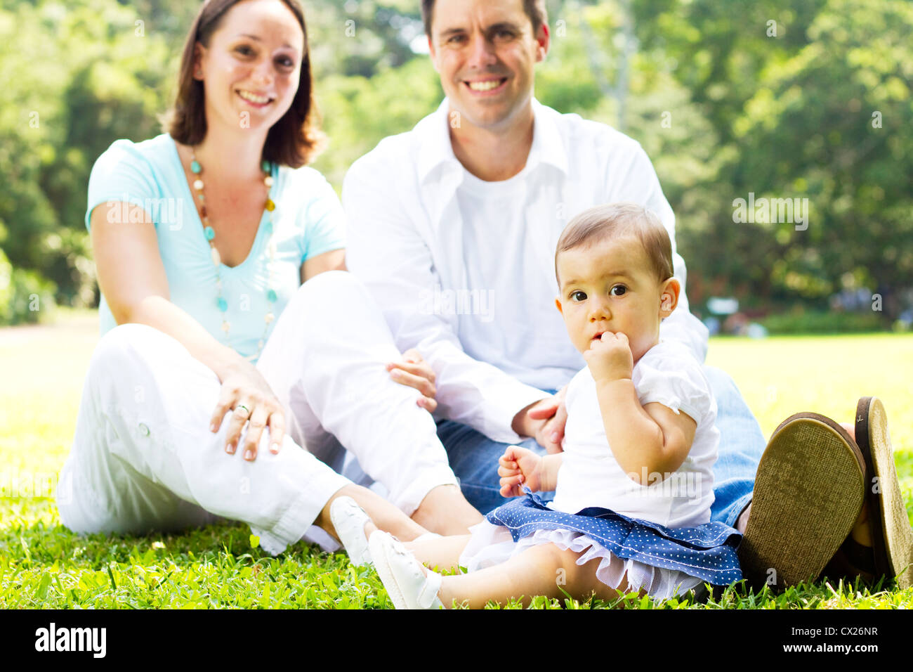 lovely young family outdoors Stock Photo - Alamy