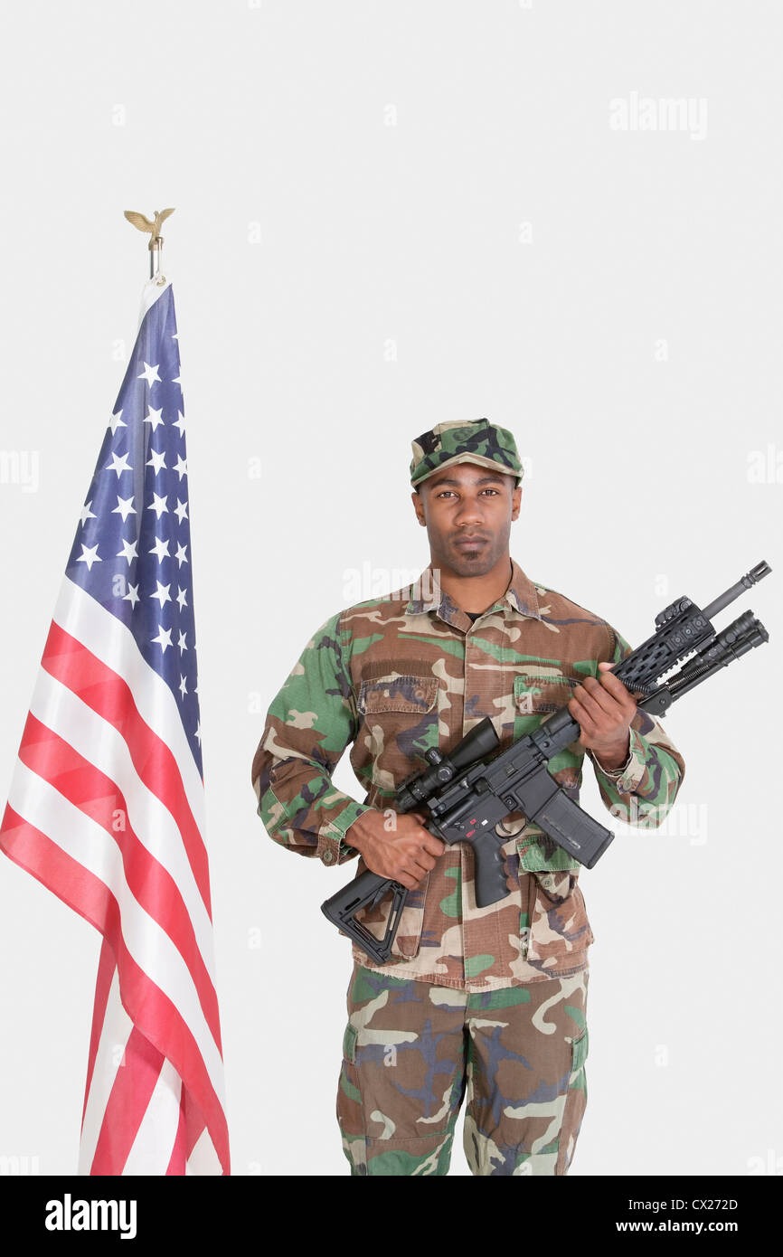 Portrait of US Marine Corps soldier with M4 assault rifle standing by ...