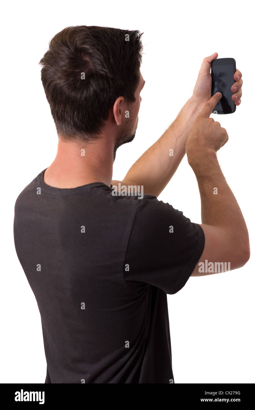 Young White Man In Black T-Shirt Working On His Smartphone Stock Photo ...