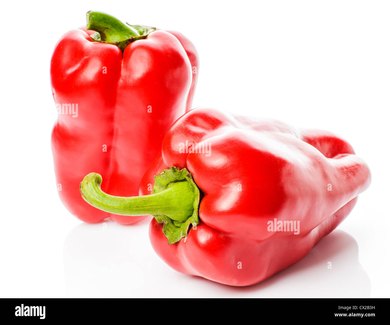 Two big red peppers isolated on white background Stock Photo - Alamy