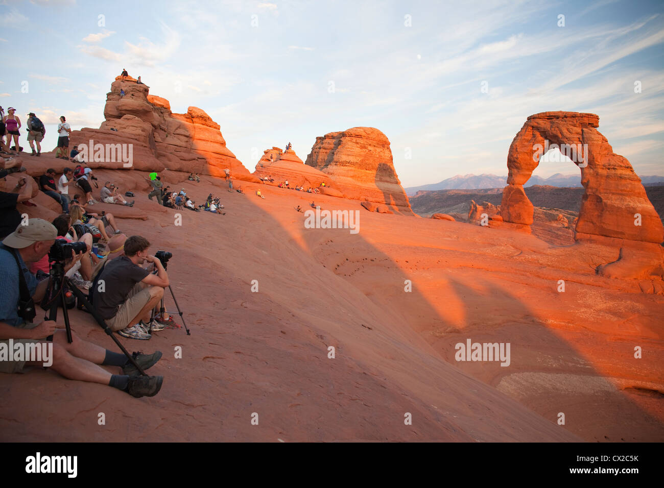 Photographers at Delicate Arch Sunset, USA Stock Photo - Alamy