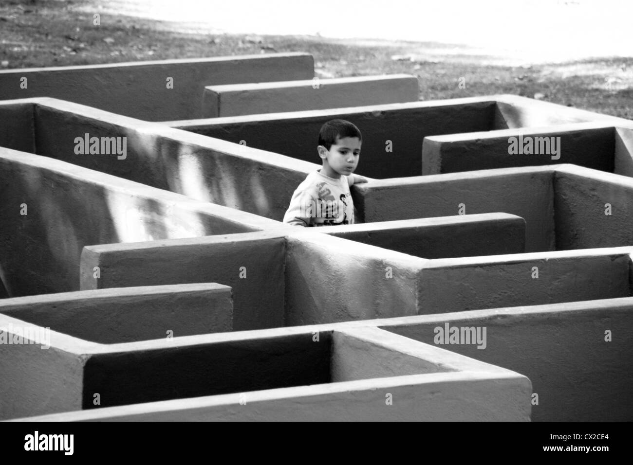 Child searching in a maze Stock Photo - Alamy